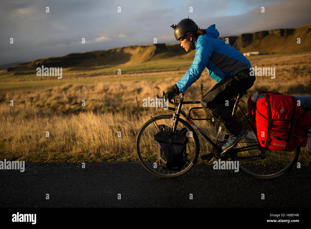 A long distance cyclist rides on route 1 in southern Iceland Stock ...