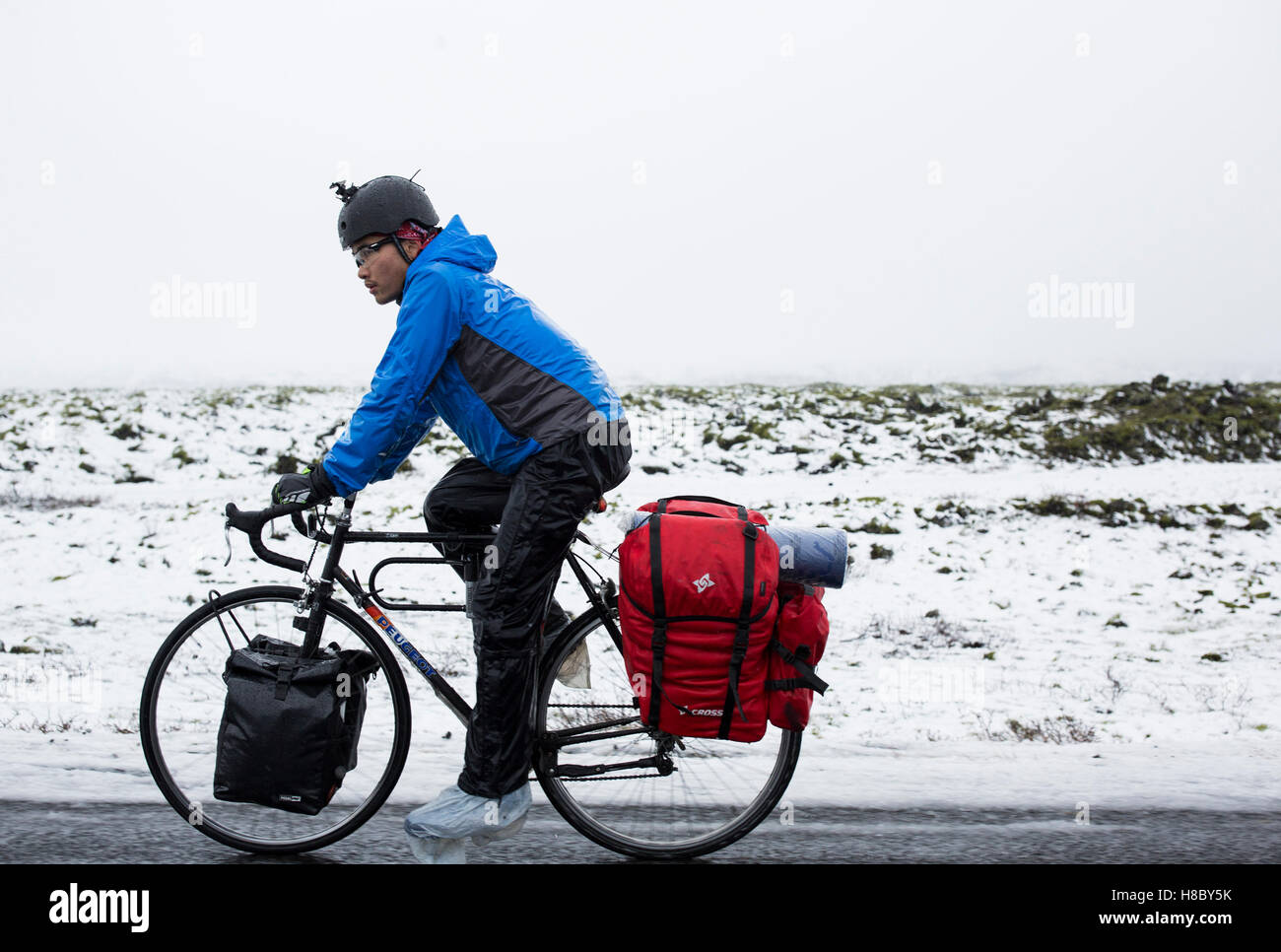 A long distance cyclist rides on route 1 in southern Iceland Stock ...