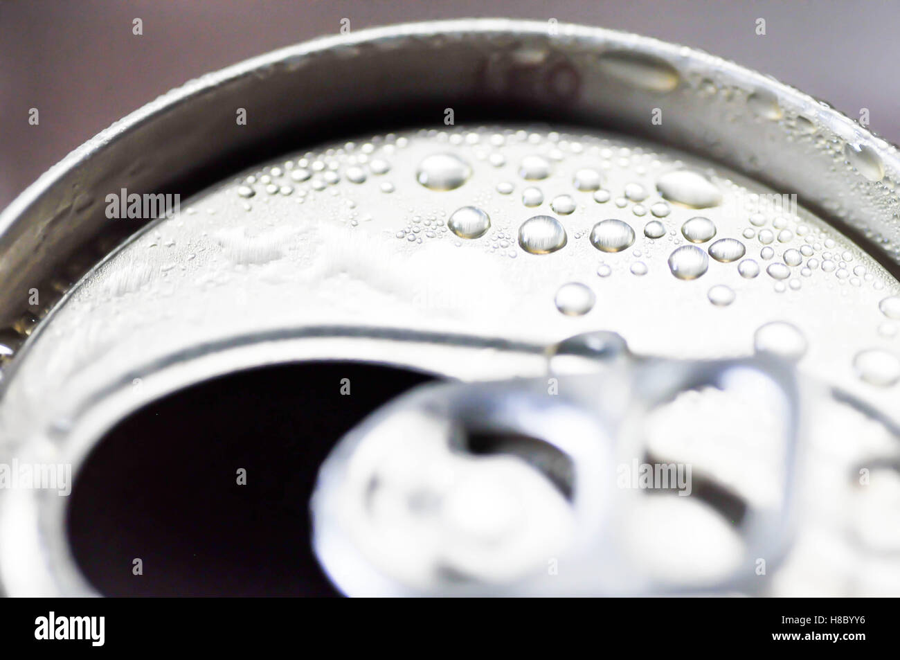 drop on a can in blur background Stock Photo - Alamy