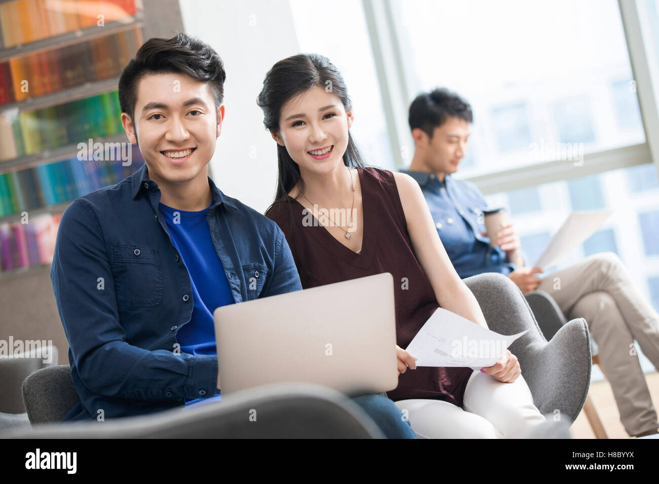 Chinese business people working with laptop in office Stock Photo - Alamy