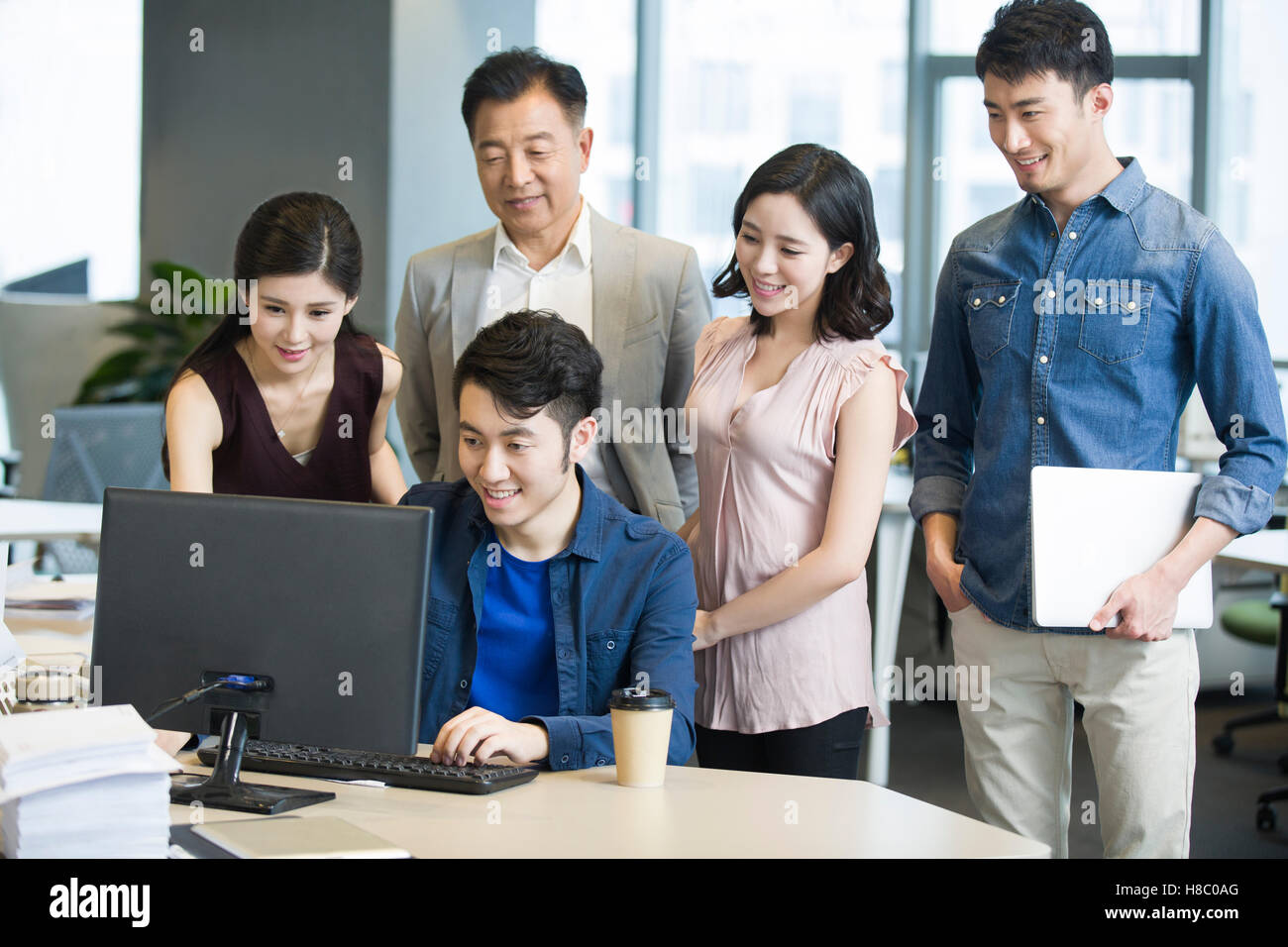 Chinese business people working together with computer Stock Photo - Alamy