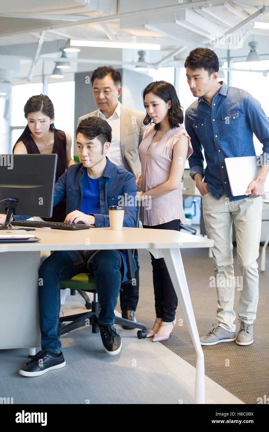 Chinese business people working together with computer Stock Photo - Alamy