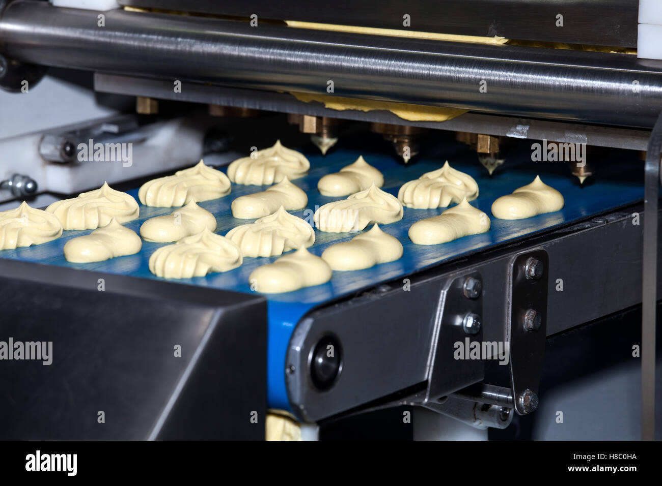 Biscuit depositing machine Stock Photo - Alamy