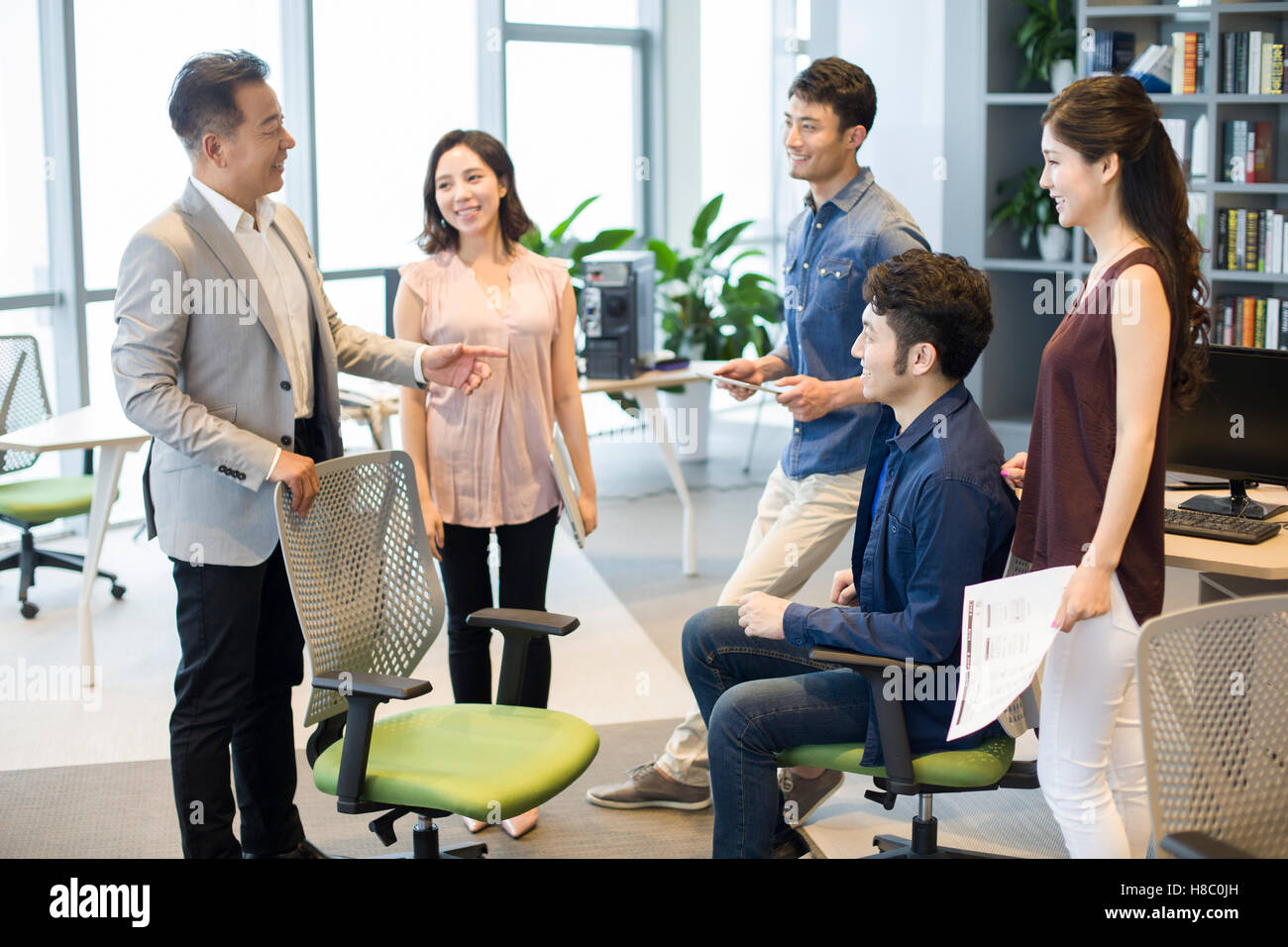 Chinese business people talking in meeting Stock Photo - Alamy