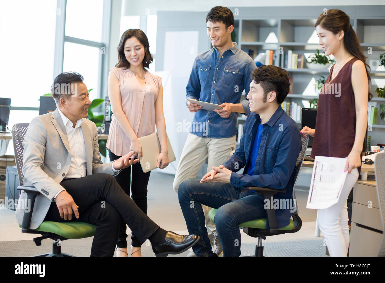 Chinese business people talking in meeting Stock Photo - Alamy