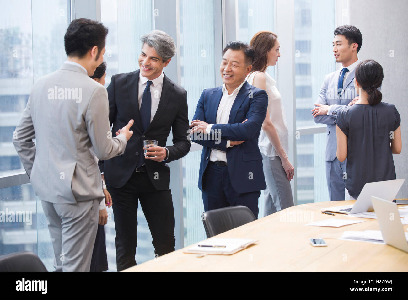 Chinese business people talking in meeting room Stock Photo - Alamy