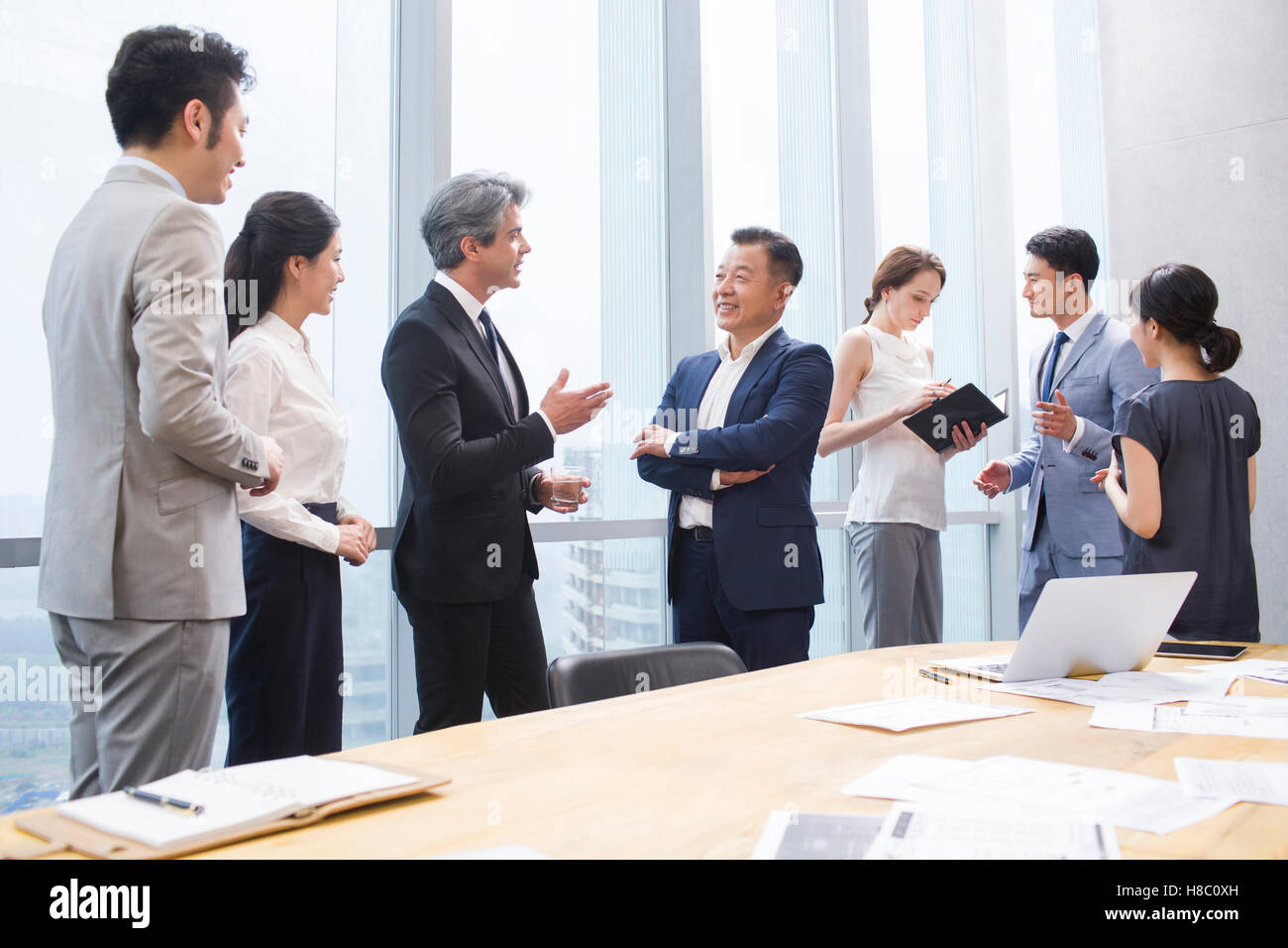 Chinese business people talking in meeting room Stock Photo - Alamy