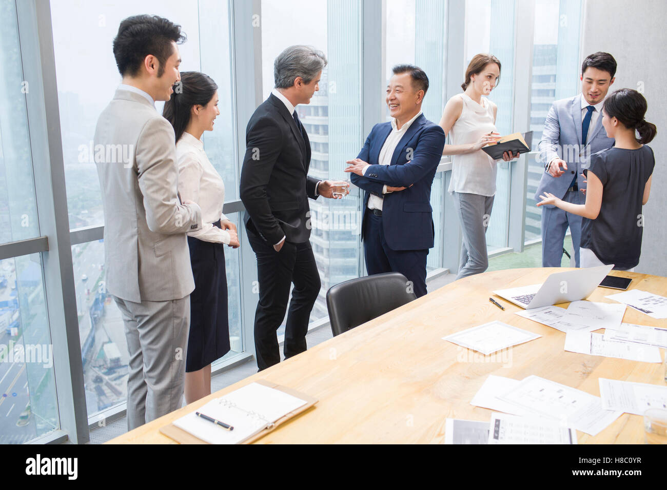 Chinese business people talking in meeting room Stock Photo - Alamy
