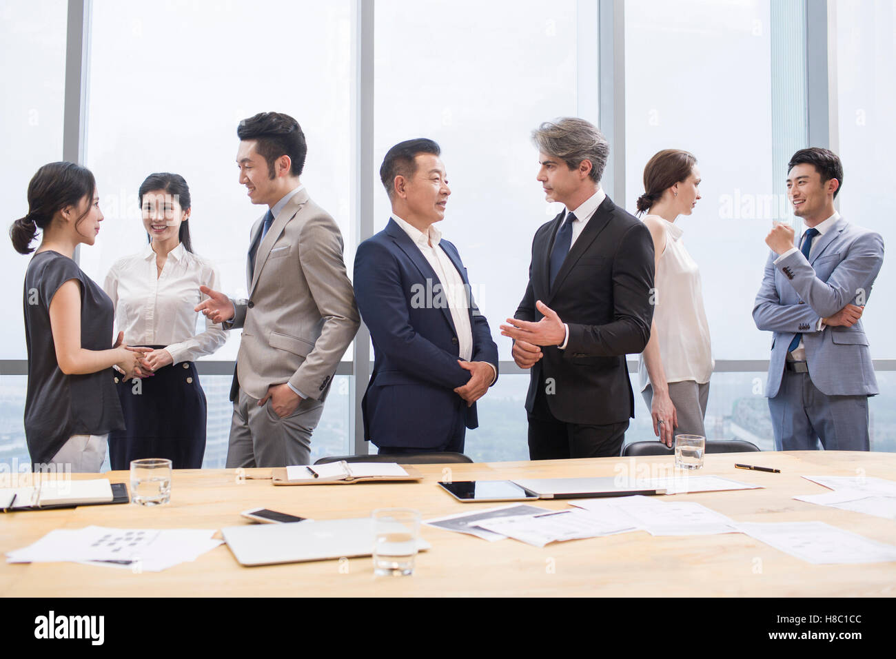 Chinese business people talking in meeting room Stock Photo - Alamy