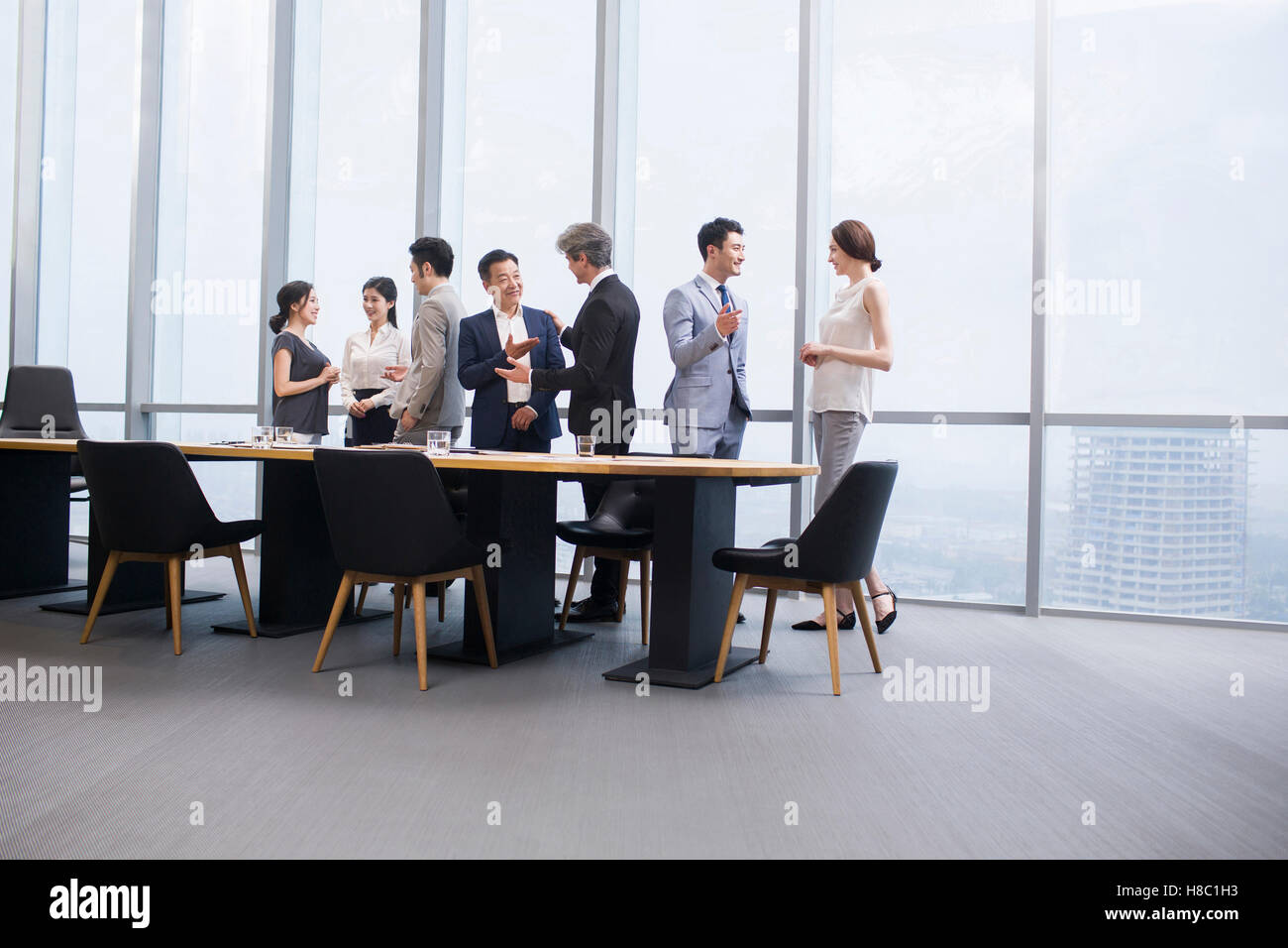 Chinese business people talking in meeting room Stock Photo - Alamy