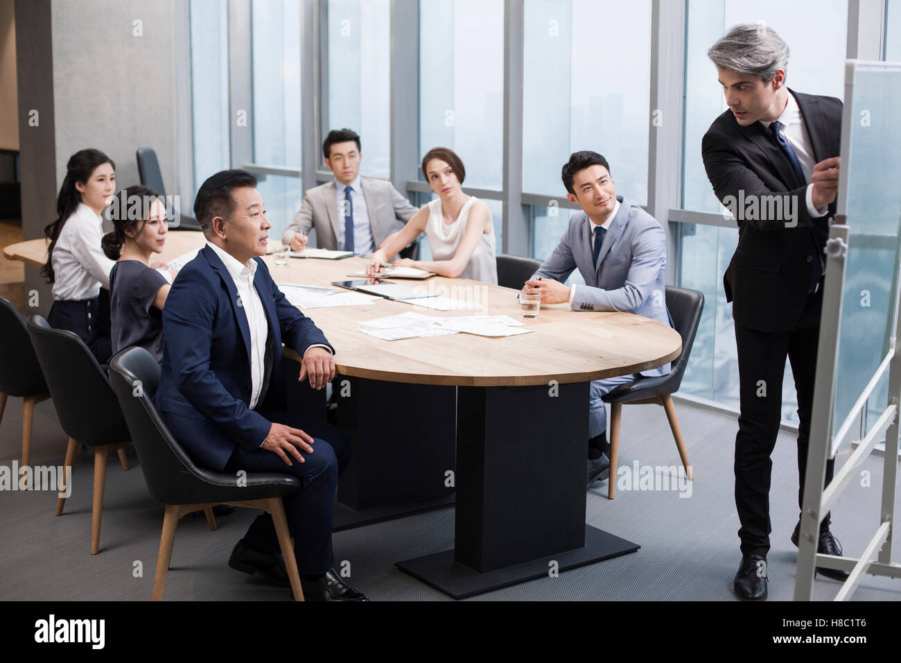 Chinese business people having meeting in board room Stock Photo - Alamy