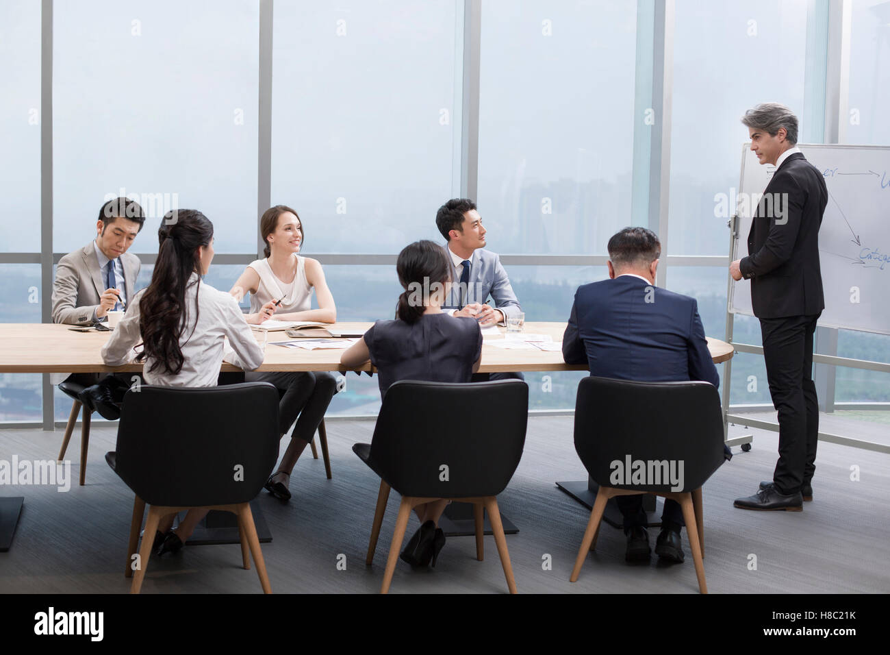 Chinese business people having meeting in board room Stock Photo - Alamy