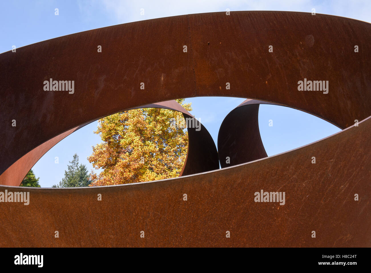 Art object in front of autumn trees on the wood of Carona on ...