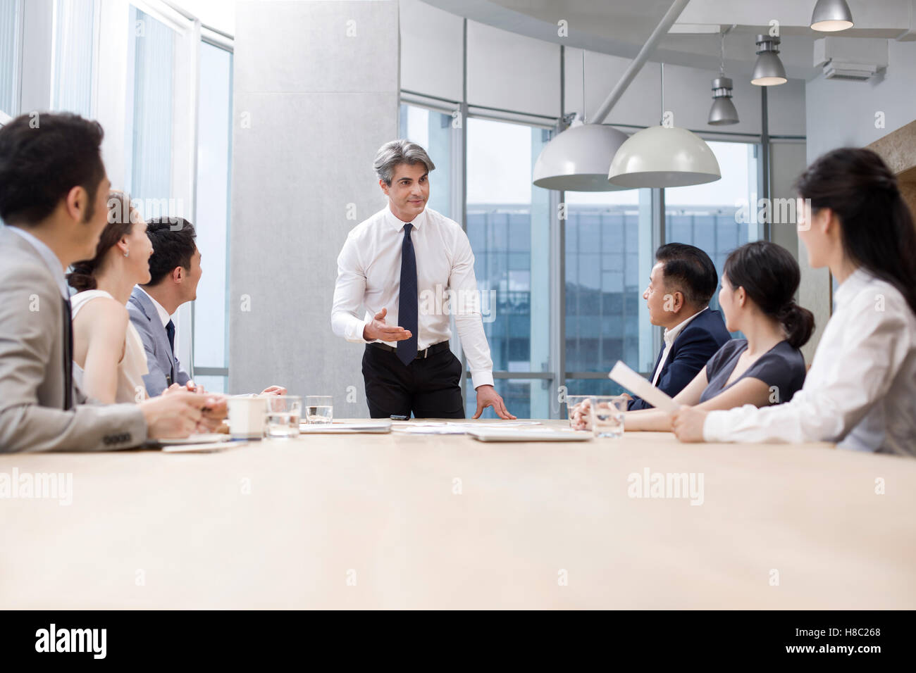 Chinese business people having meeting in board room Stock Photo - Alamy