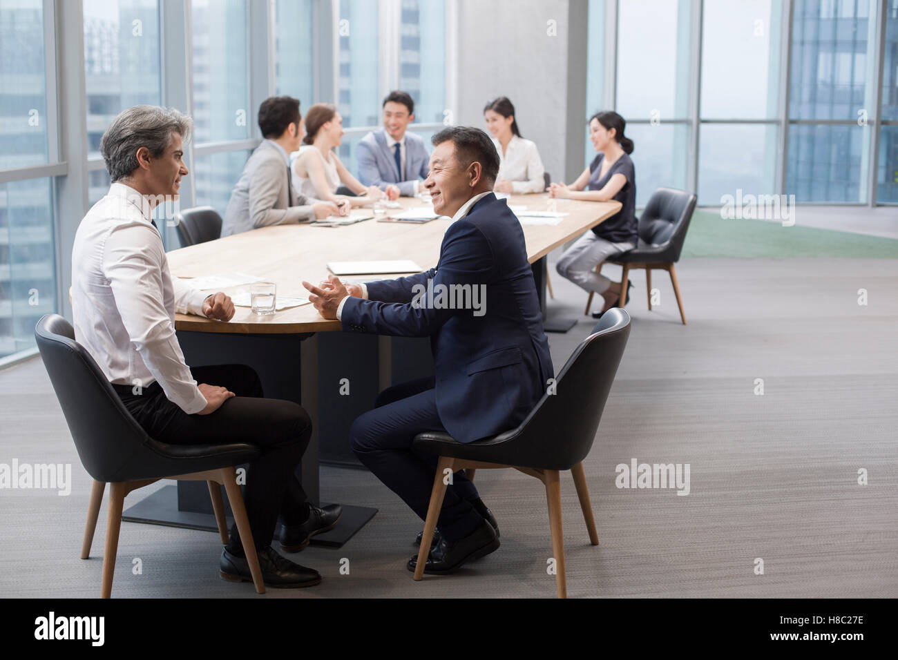 Chinese business people having meeting in board room Stock Photo - Alamy