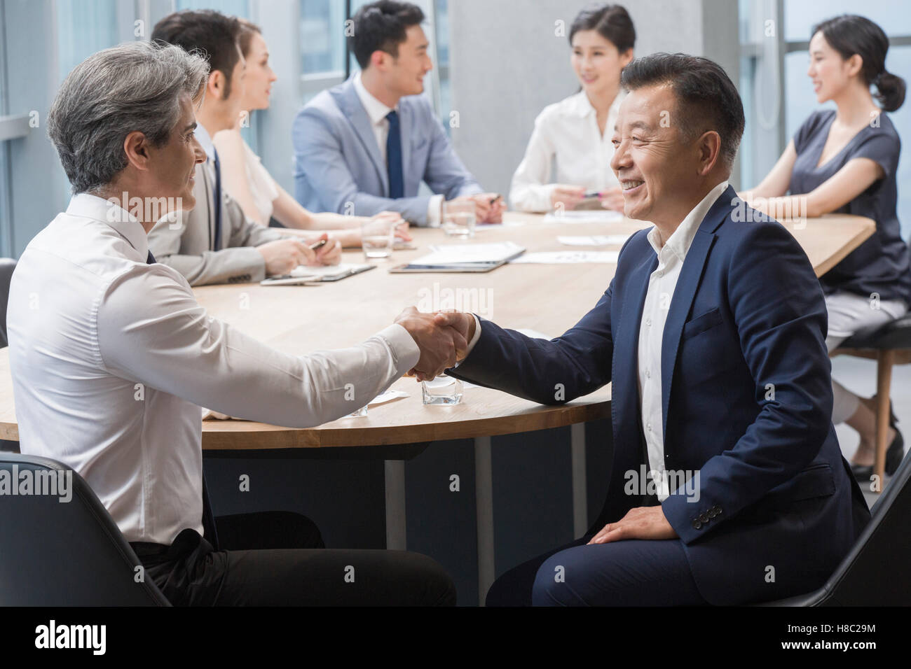 Chinese business people having meeting in board room Stock Photo - Alamy