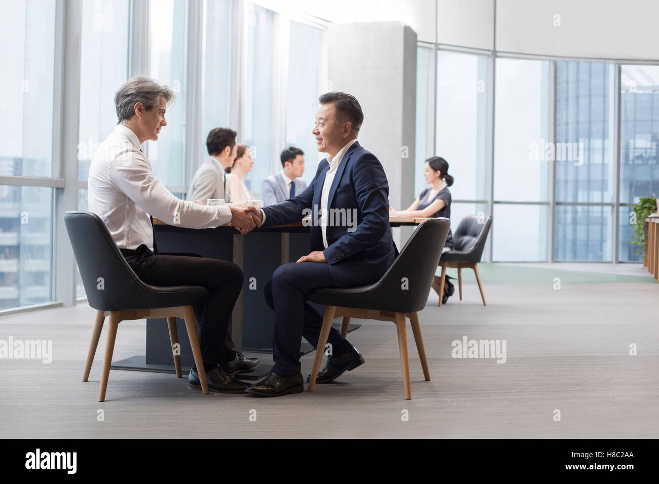 Chinese business people having meeting in board room Stock Photo - Alamy