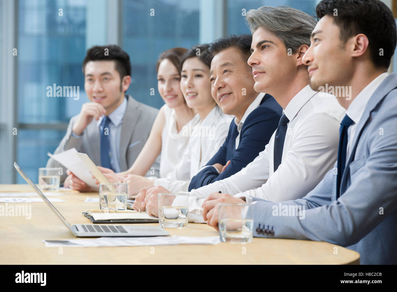 Chinese business people having meeting in board room Stock Photo - Alamy