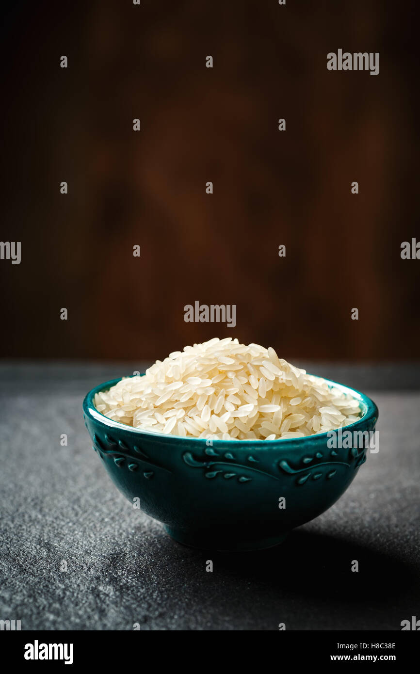 White rice in a blue authentic bowl with copy space Stock Photo - Alamy