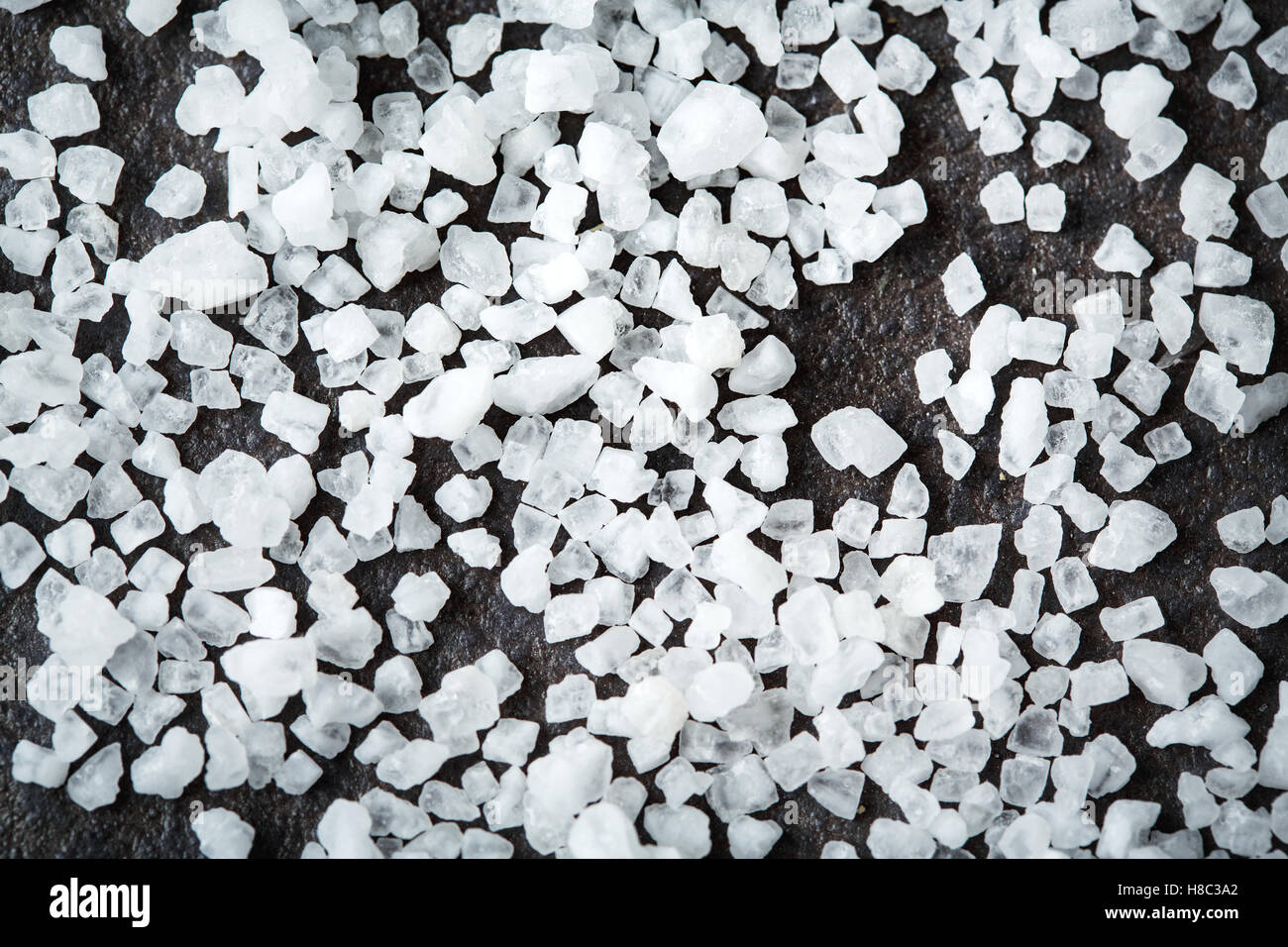 Natural organic rock salt on dark background, close-up Stock Photo - Alamy