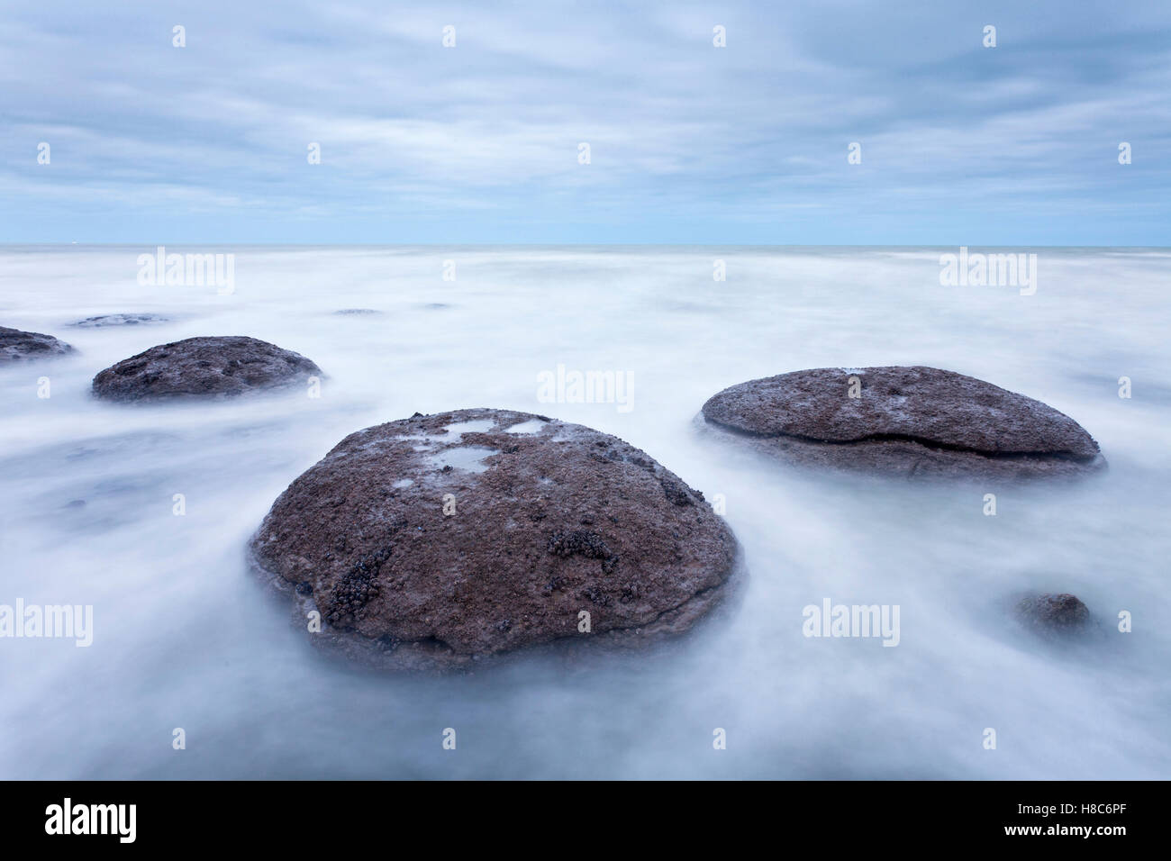 Boulders on beach, Belgium Stock Photo - Alamy