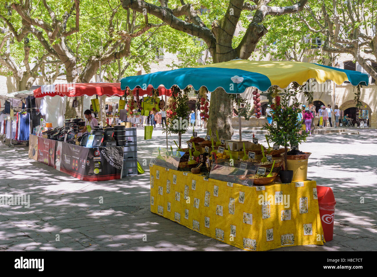 A local produce market stall in Place aux Herbes in medieval Uzès, Gard ...