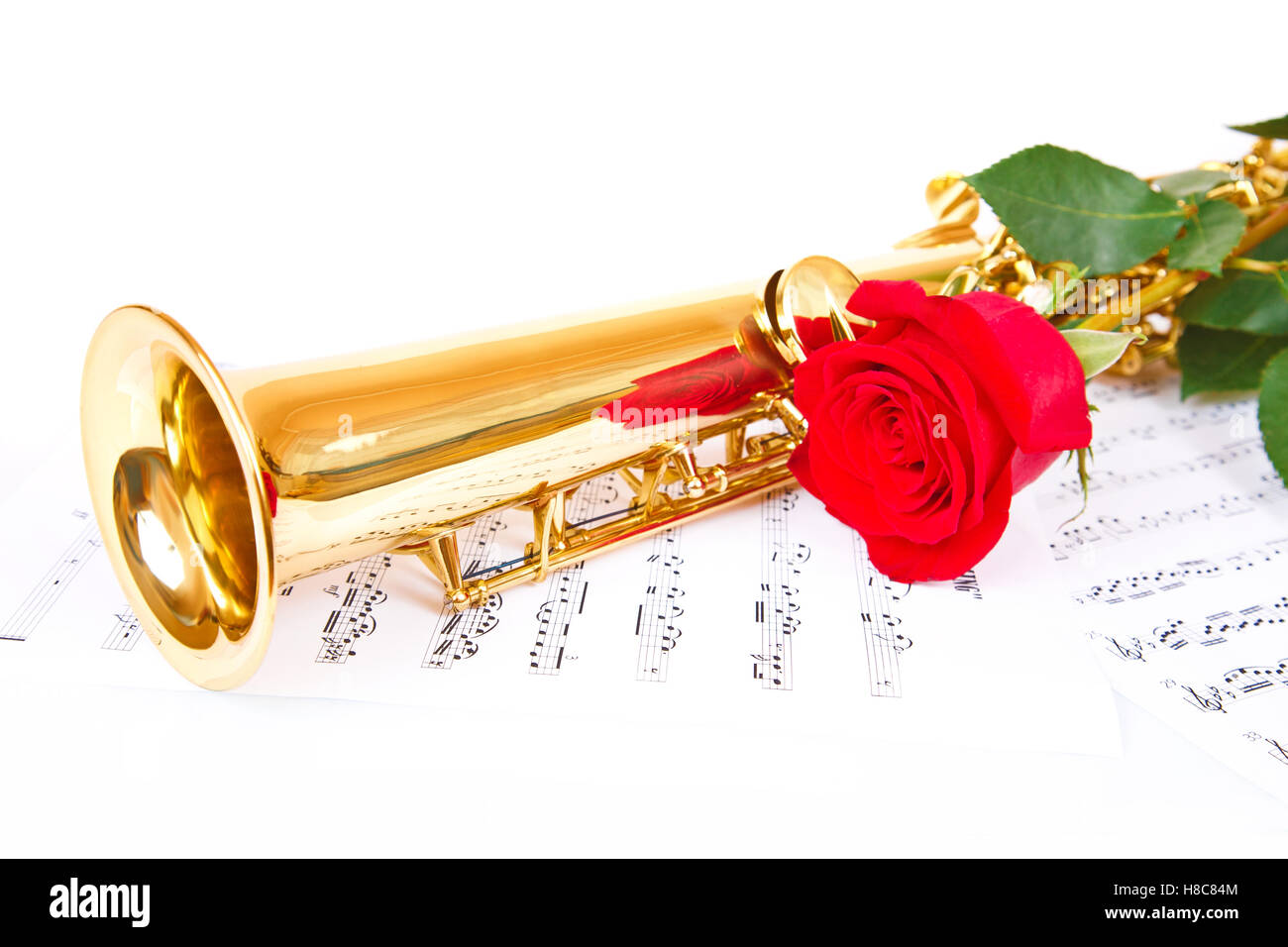 Musical notes and saxophone with red rose Stock Photo - Alamy