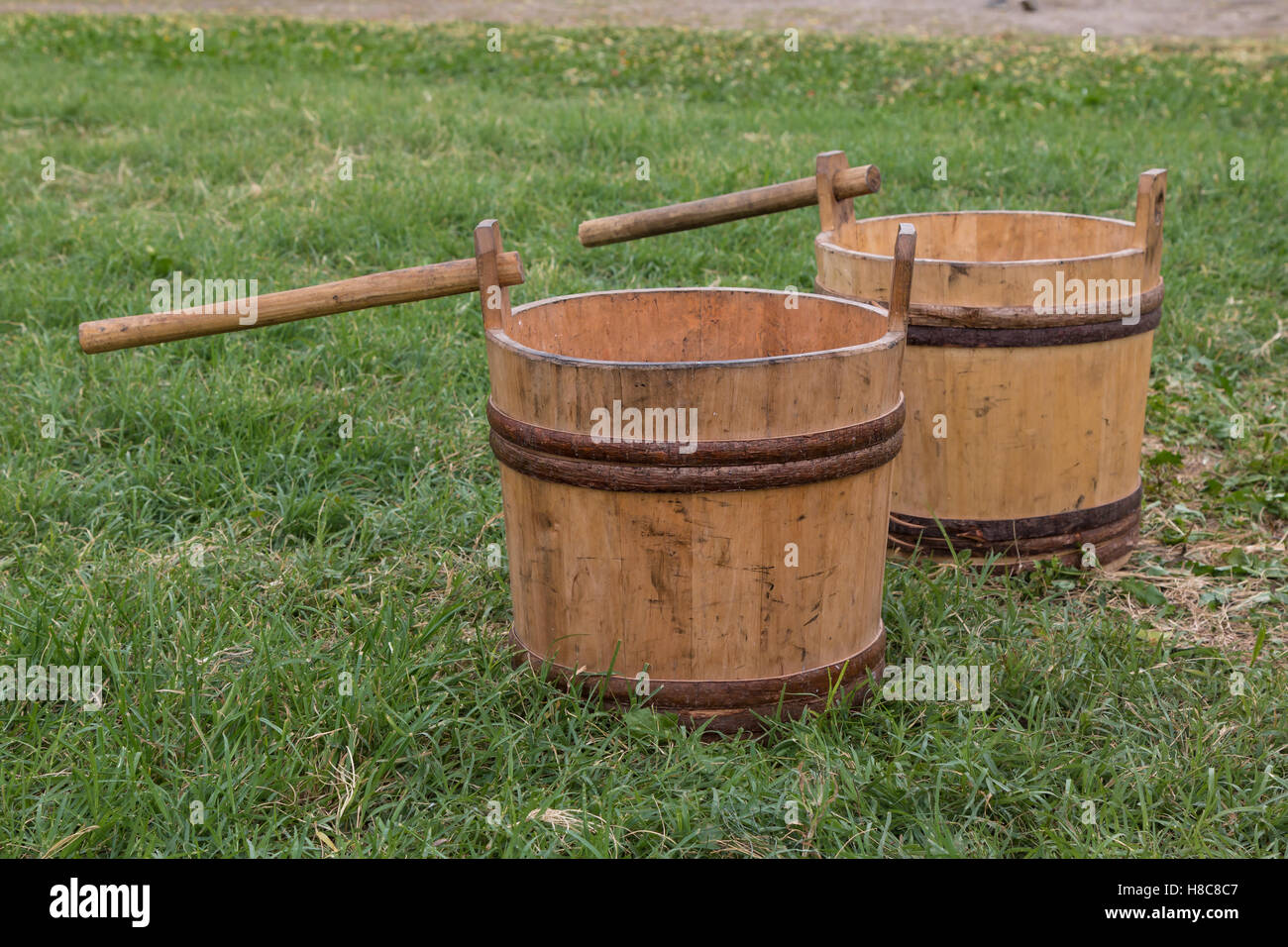 Two Wooden Pails on Meadow, Outside in Campsite Stock Photo - Alamy