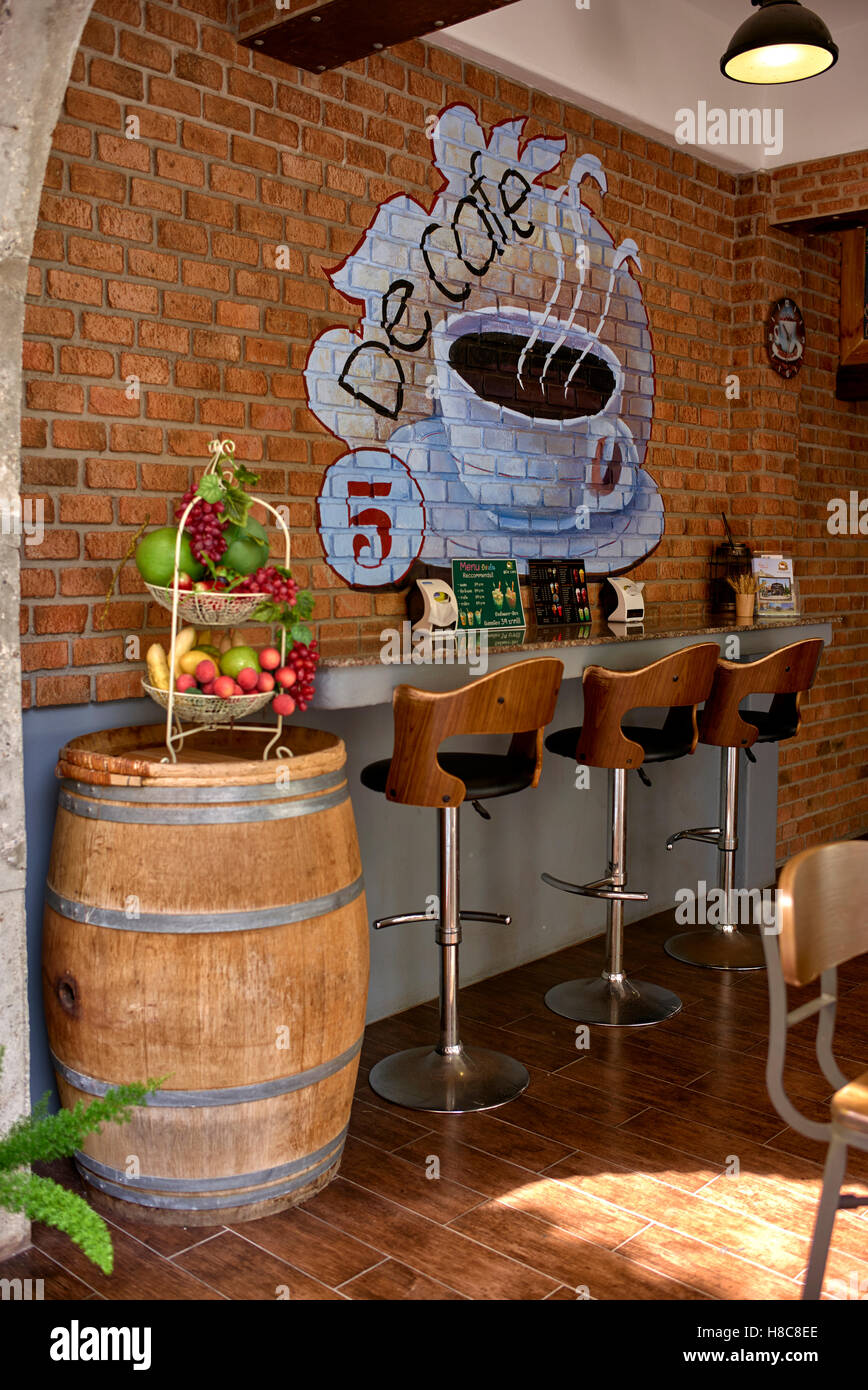 Boutique café interior with appropriate wall art Stock Photo - Alamy