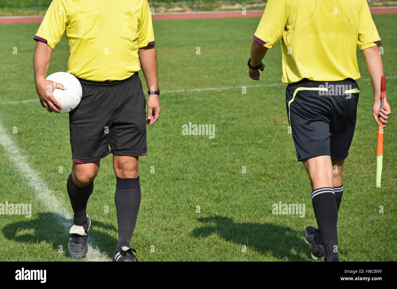 Soccer referees on the field before match Stock Photo - Alamy