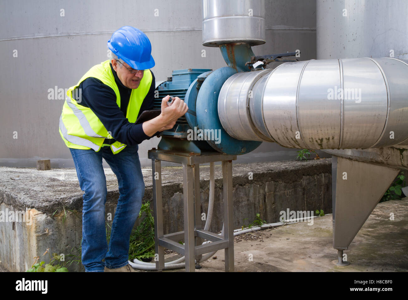 skilled worker making maintenance in industrila premises Stock Photo ...