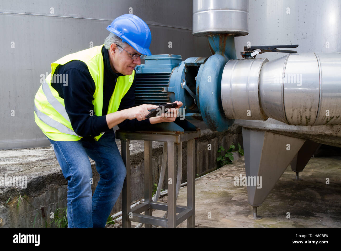 skilled worker making maintenance in industrila premises Stock Photo ...