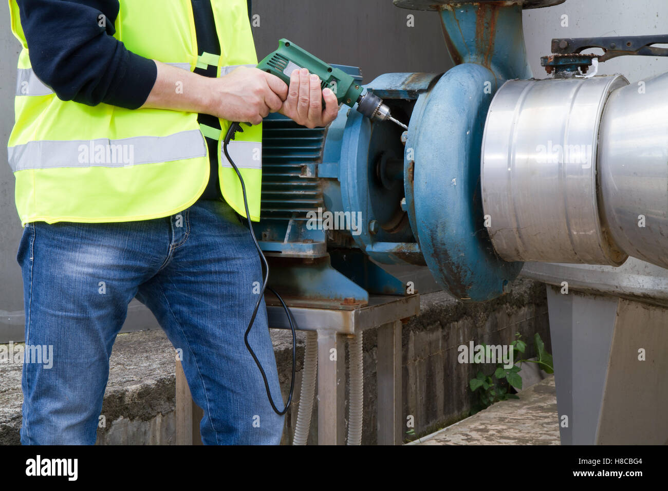 skilled worker making maintenance in industrila premises Stock Photo ...