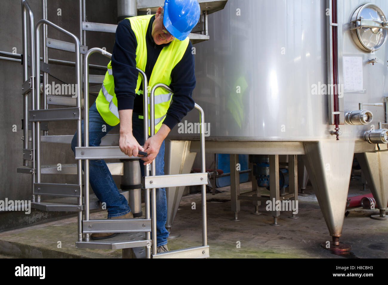 skilled worker making maintenance in industrila premises Stock Photo ...