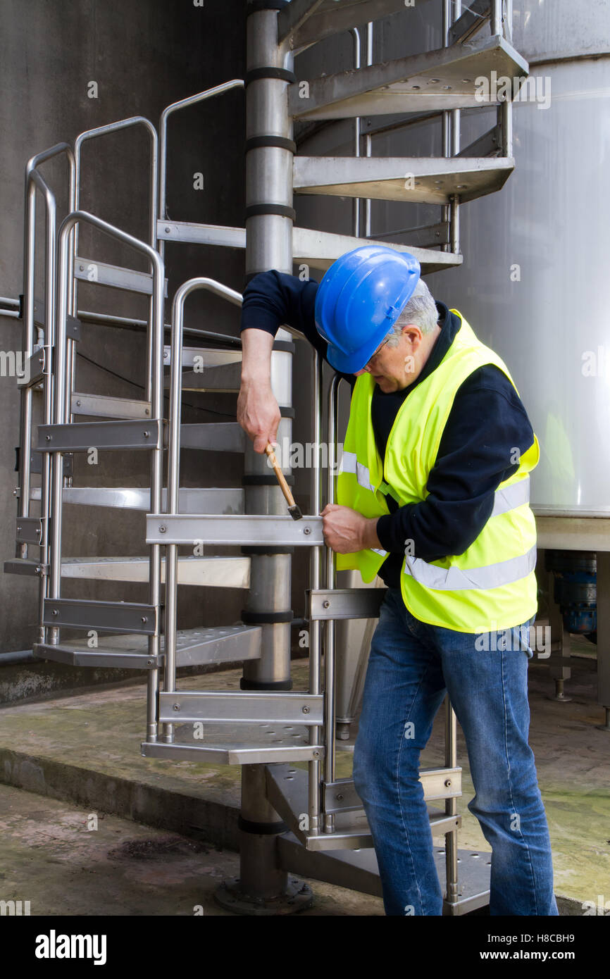 skilled worker making maintenance in industrila premises Stock Photo ...