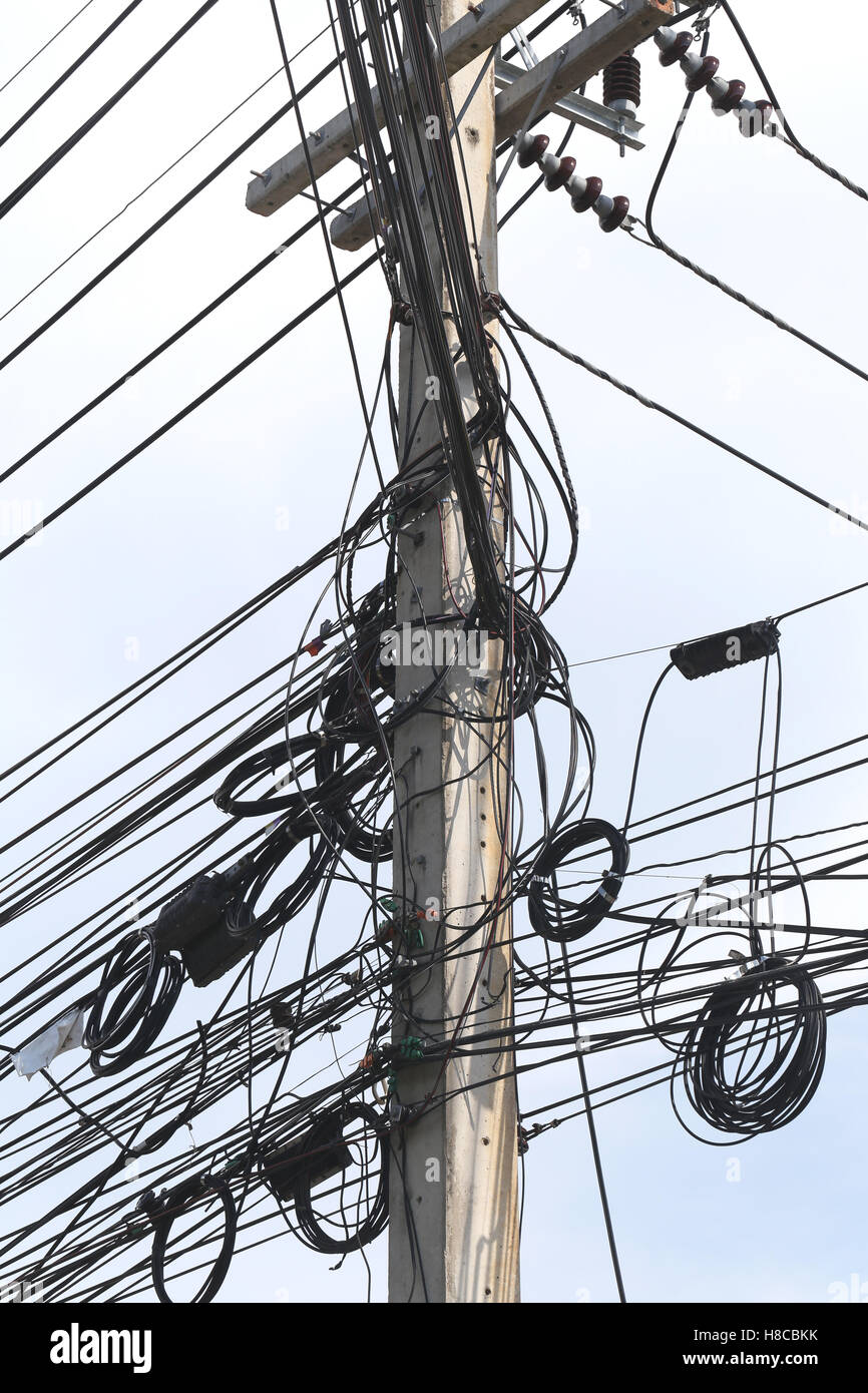 Messy cable electricity post due to poor planning on installing the ...