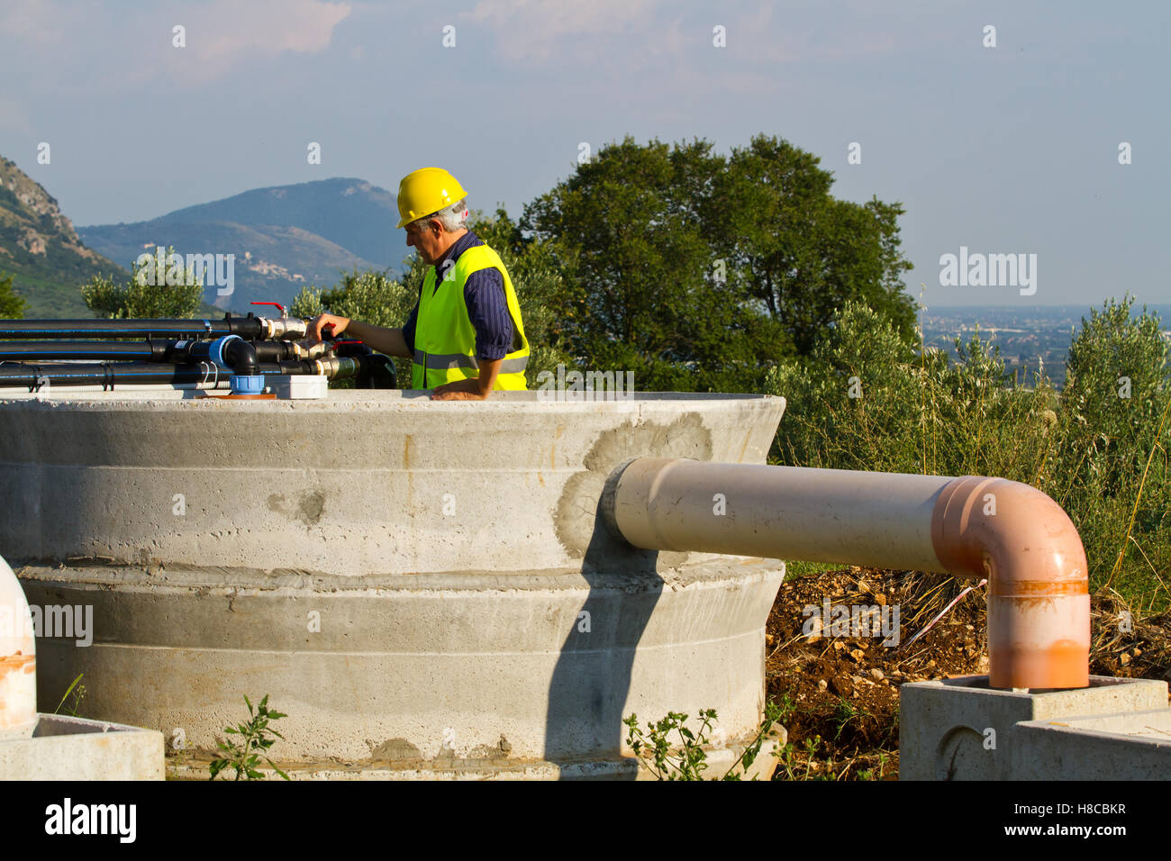 plumber at work in a building site Stock Photo - Alamy