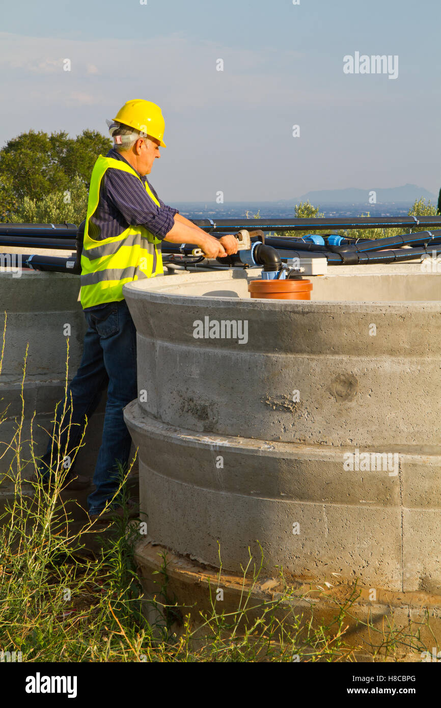 plumber at work in a building site Stock Photo - Alamy