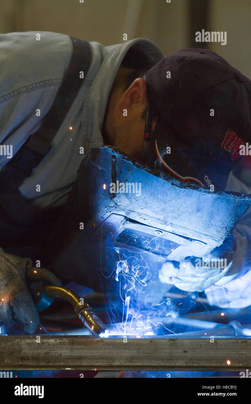 metalworker at work in a workshop Stock Photo - Alamy