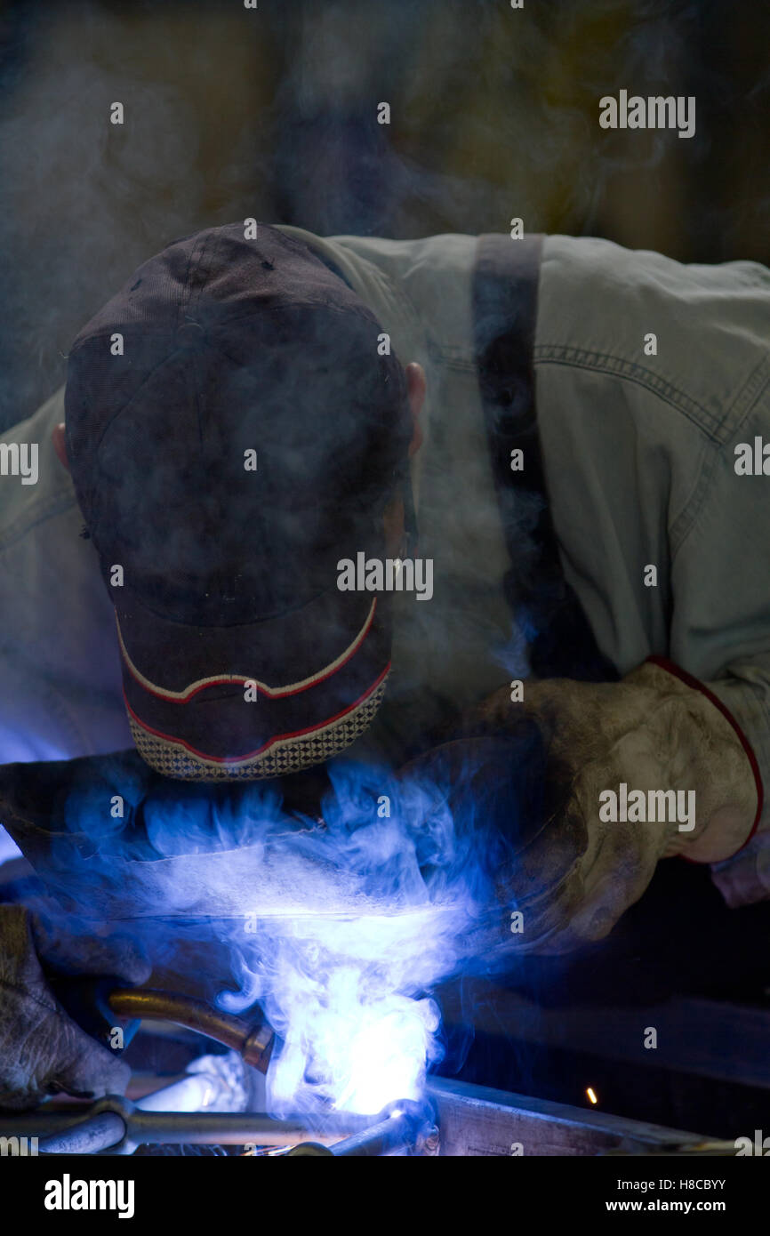 metalworker at work in a workshop Stock Photo - Alamy