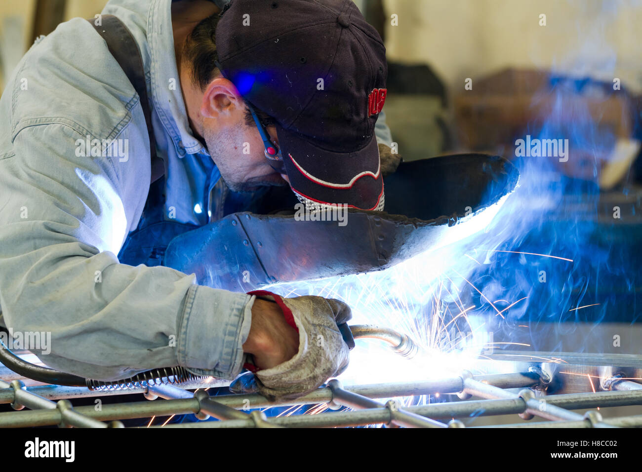 metalworker at work in a workshop Stock Photo - Alamy