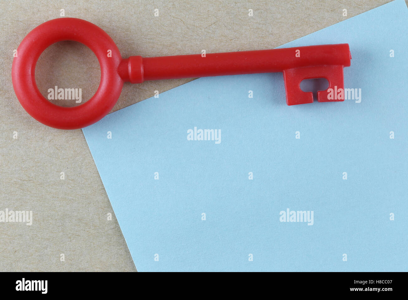 Red Plastic key is placed on Blue Paper Note and can input text to it ...