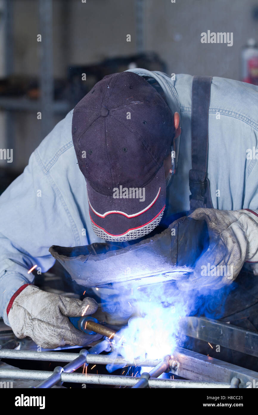 metalworker at work in a workshop Stock Photo - Alamy
