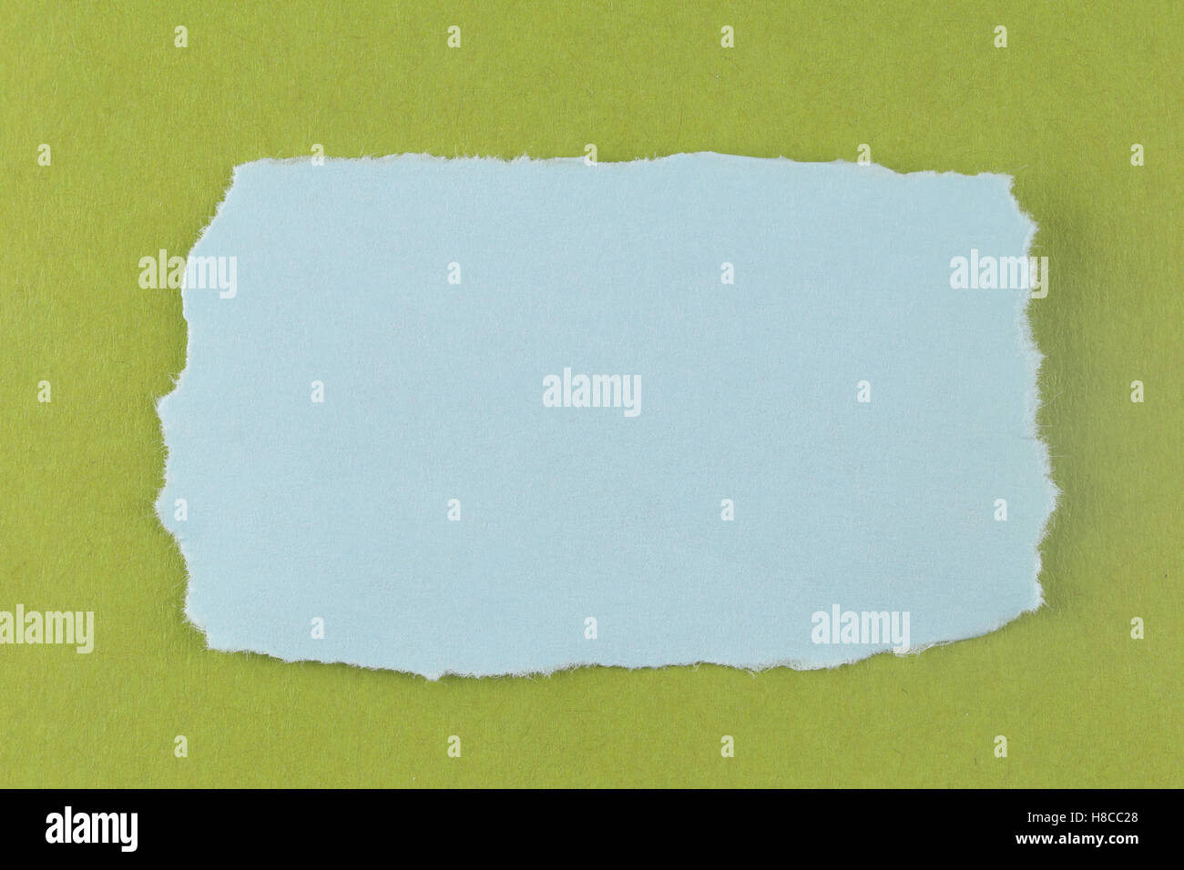 Blue paper tear on green cardboard background and you can input text in ...