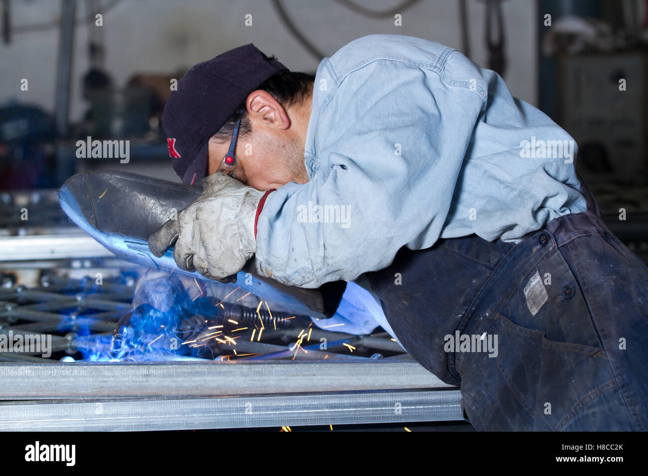 metalworker at work in a workshop Stock Photo - Alamy