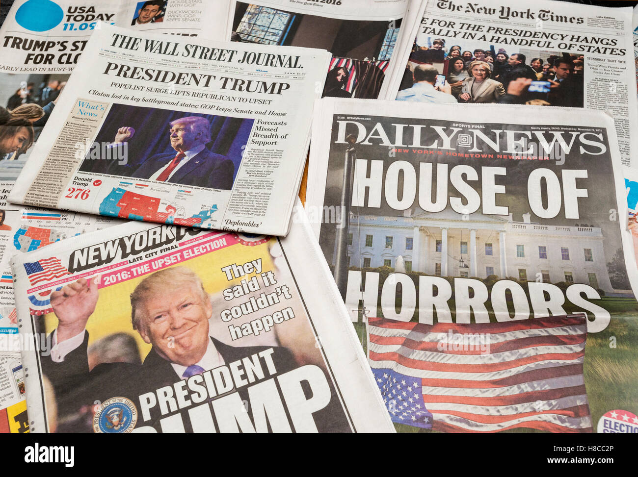 A collection of newspapers report on the previous day's election, seen ...