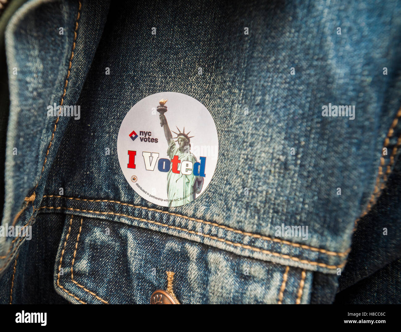 A voter wears her "I Voted" sticker on Election Day in New York on ...