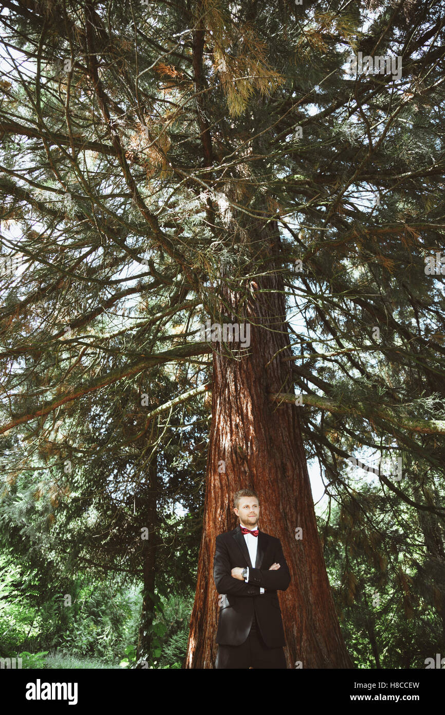Loving couple standing under tree hi-res stock photography and images ...