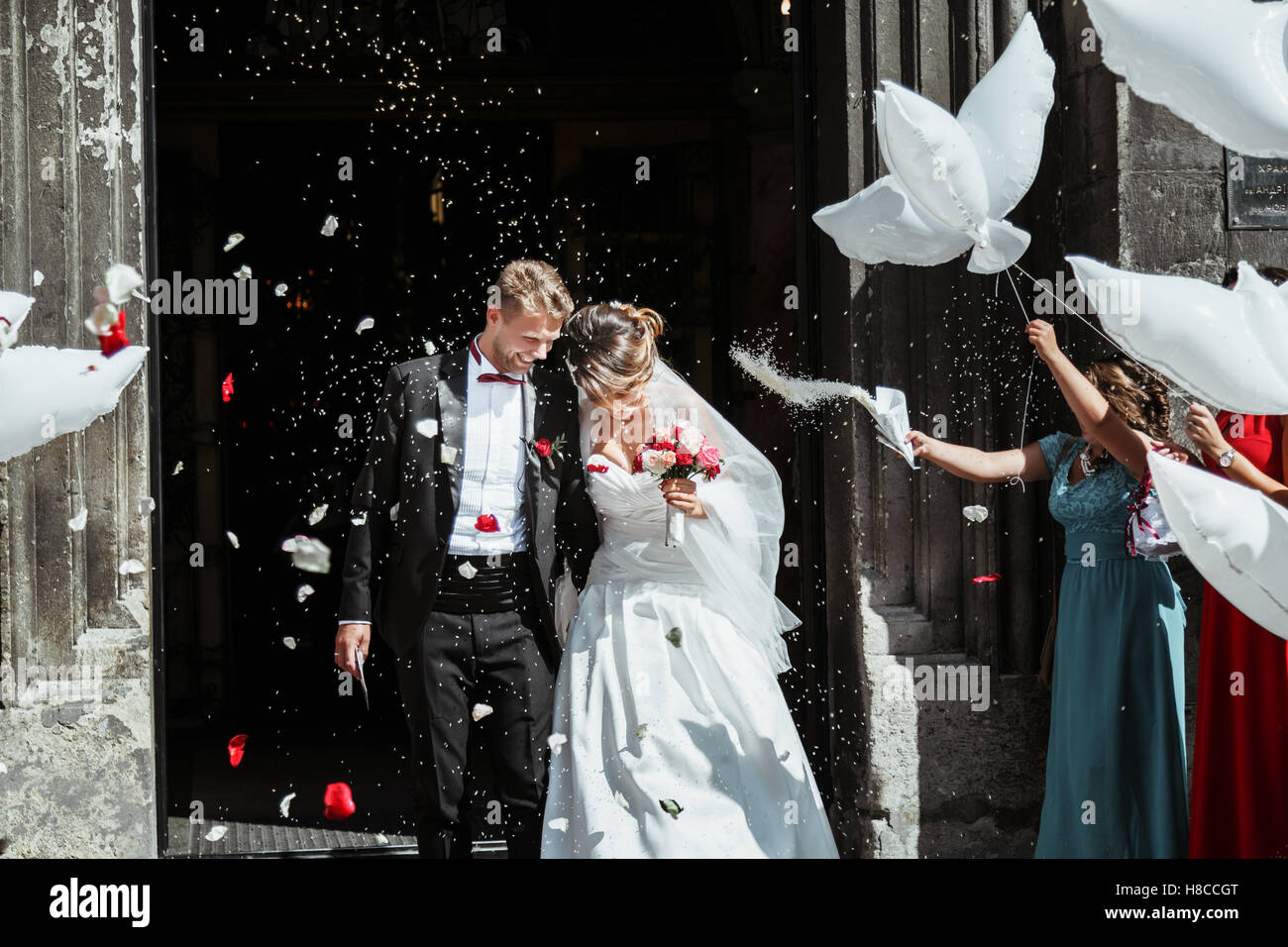 Bride and groom going out of church Stock Photo - Alamy
