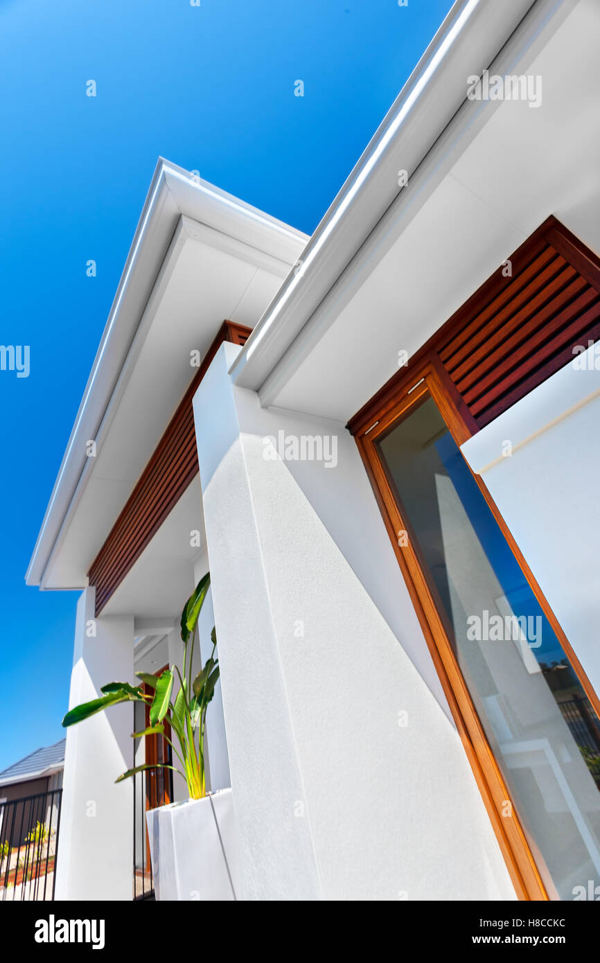 Front of the luxurious house and close up to the wall with the window ...